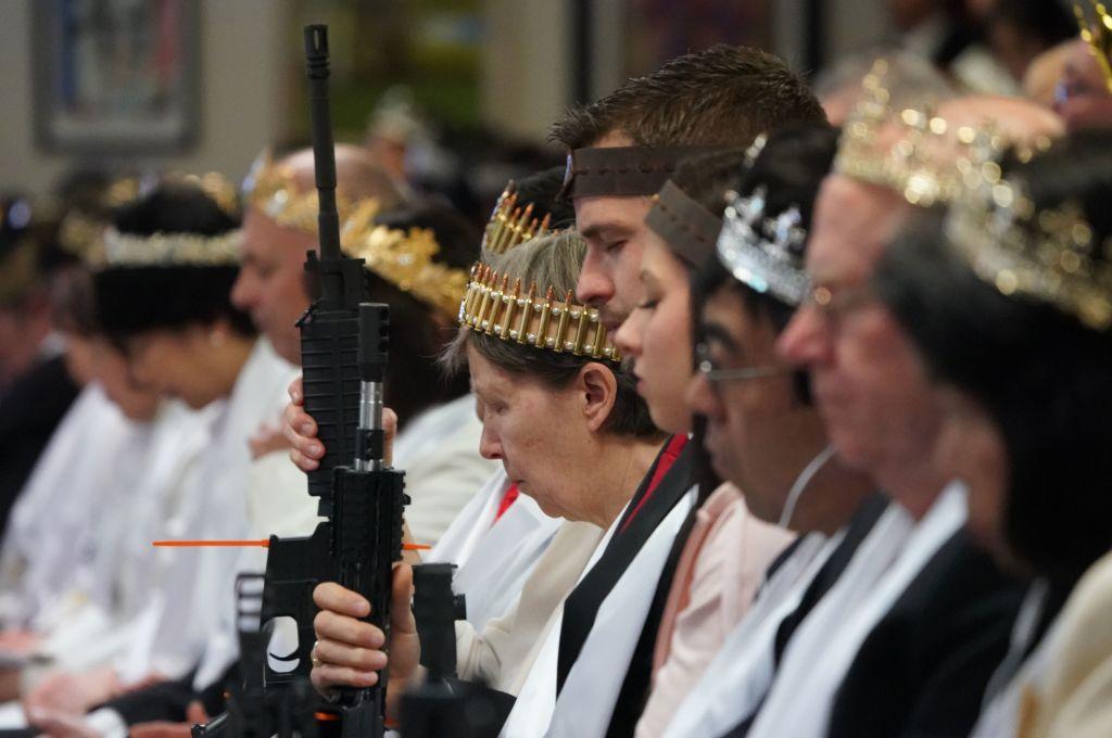 Church Holds "Blessing Ceremony" for Members and Their Guns