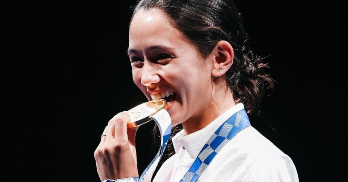 Why Do Olympians Bite Their Medals? What's Behind the Tradition?