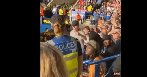 Kid Taunts Two Angry Football Fans, Others Cheer Him On