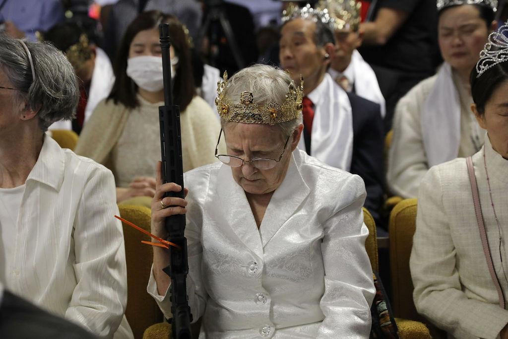 Church Holds "Blessing Ceremony" for Members and Their Guns