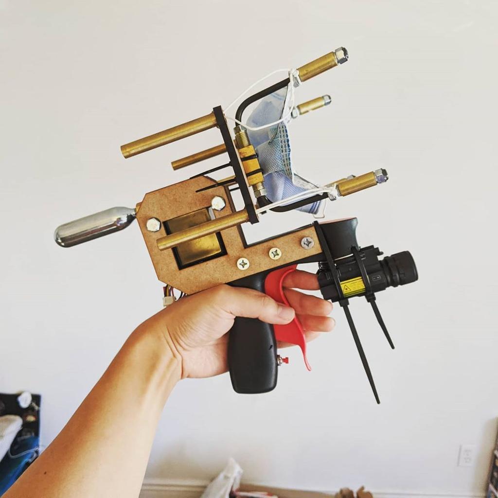 Man Invented a Gun That Shoots Masks Onto People's Faces