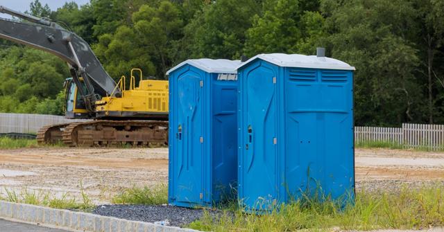 Woman Shares OSHA Poop Law Sticker Inside Porta Potty